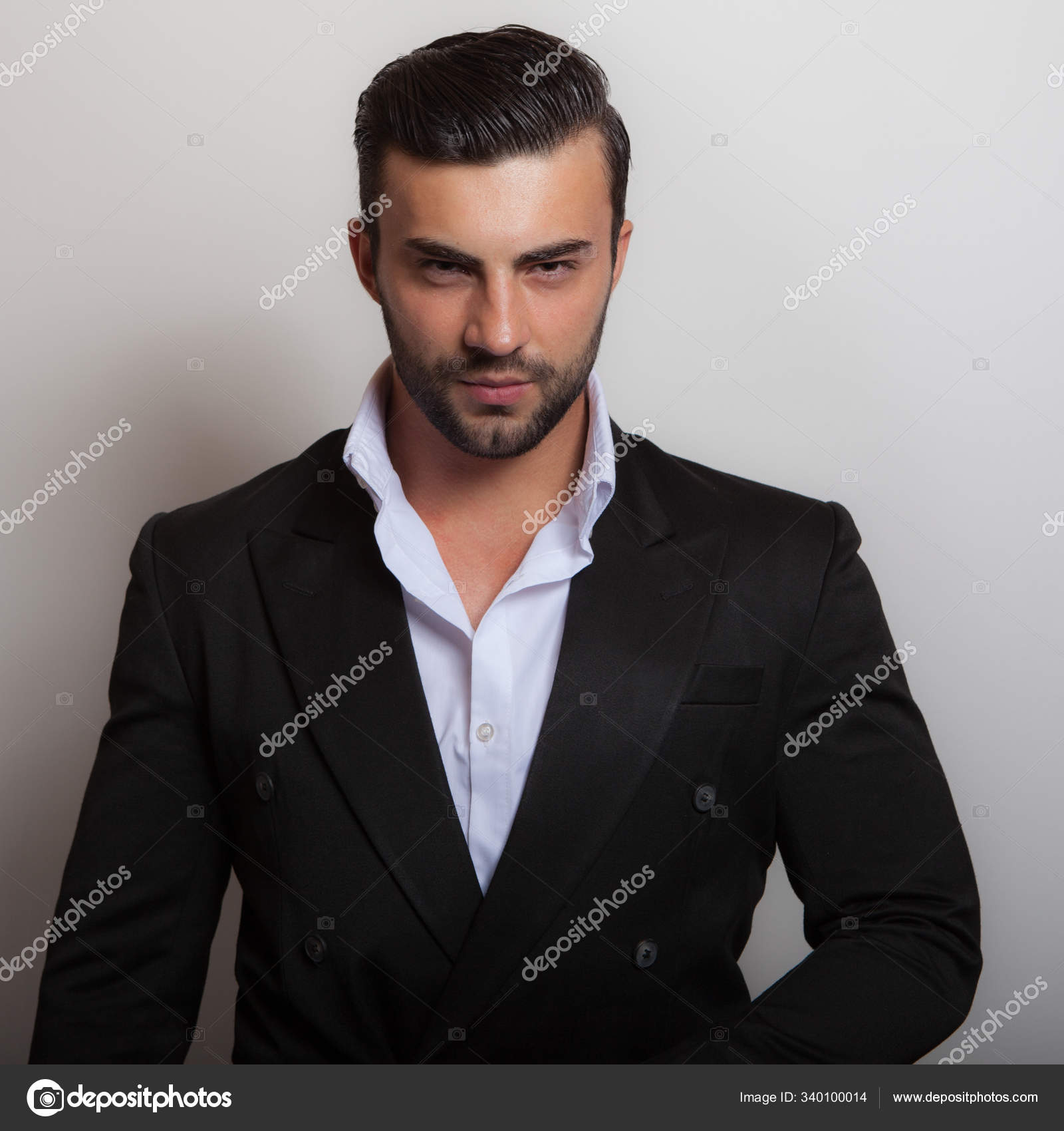 Handsome young elegant man studio portrait. Stock Photo by ©innervision ...