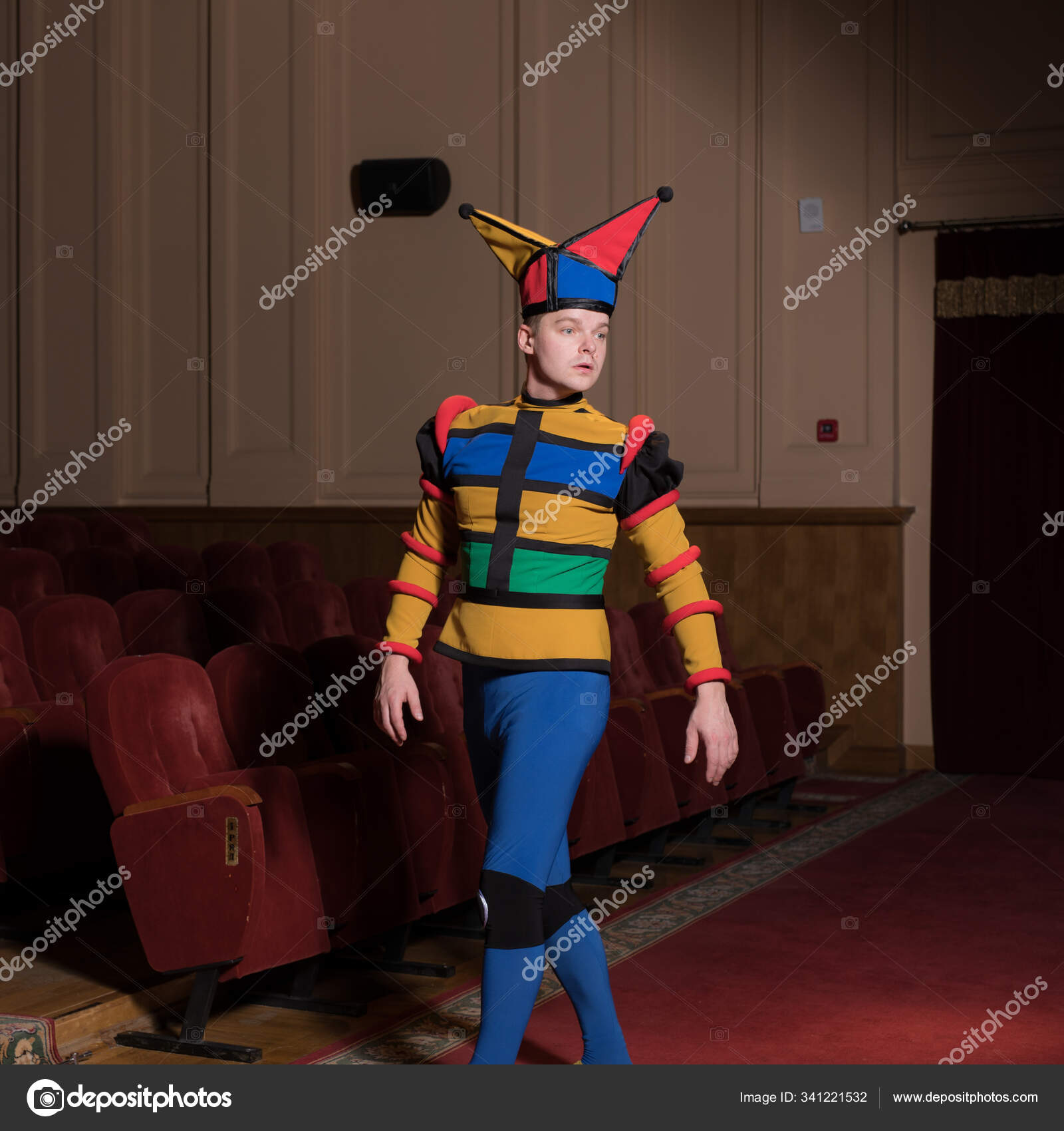 Actor dressed jesters costume in interior of old theater. Stock Photo ...