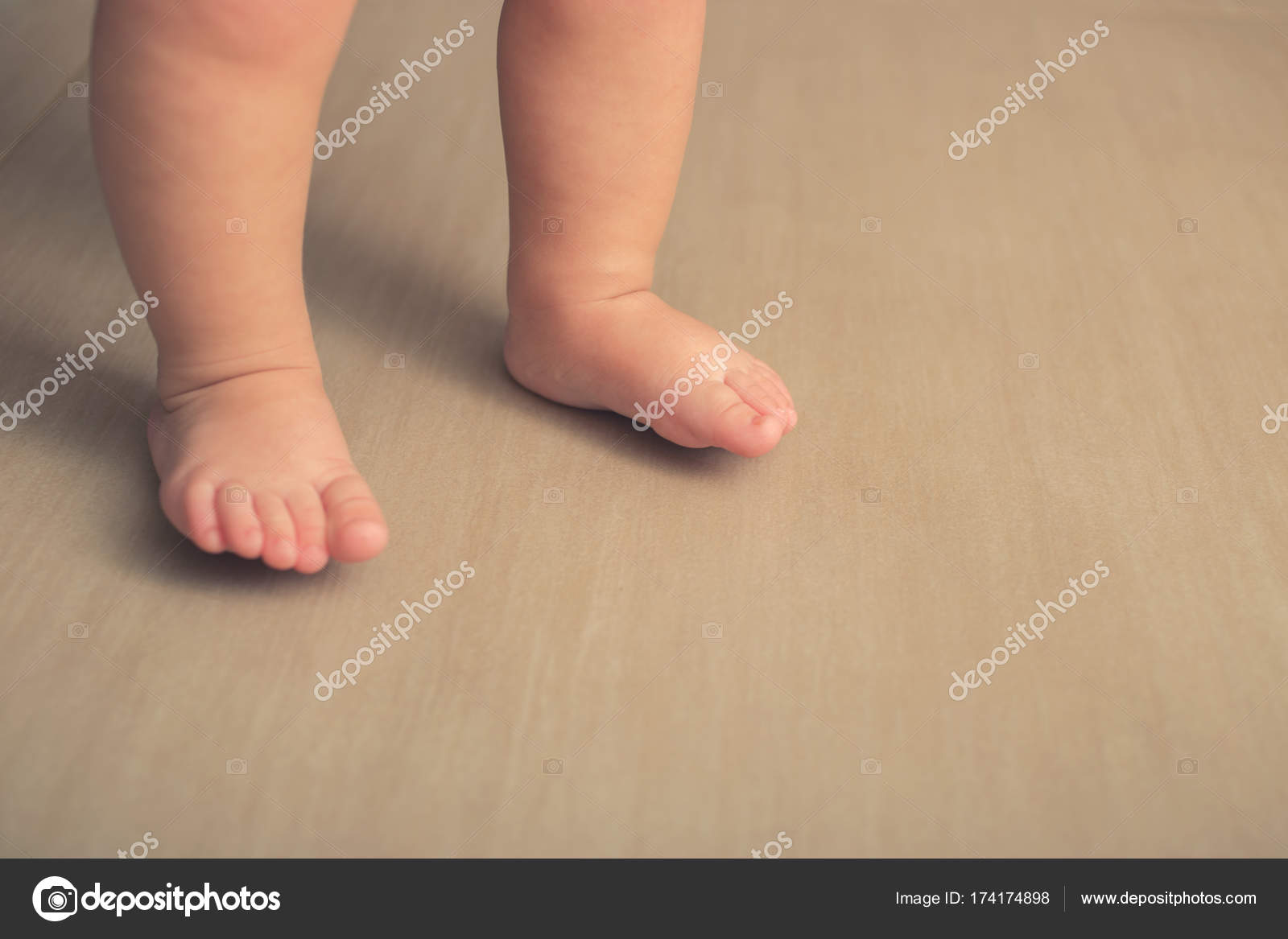 Baby's first steps Stock Photo by ©portokalis 174174898