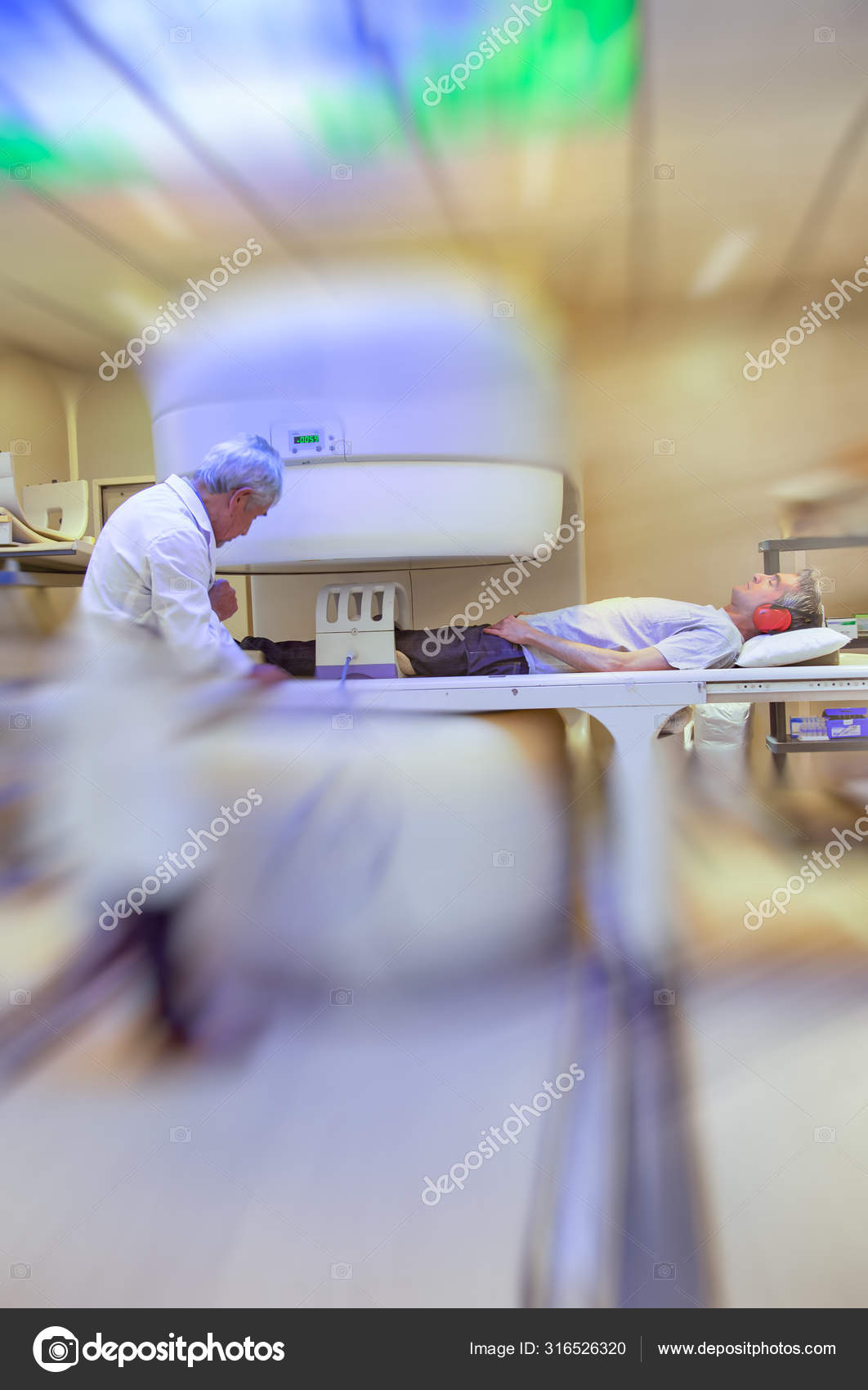Man undergoing open MRI scan at hospital Stock Photo by ©jovannig 316526320