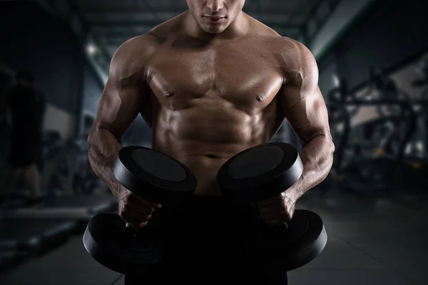 Athletic muscular man training biceps — Stock Photo © alphaspirit ...