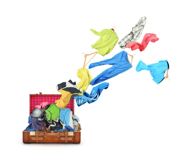 Clothes falling out of the basket in pile isolated on white back Stock ...