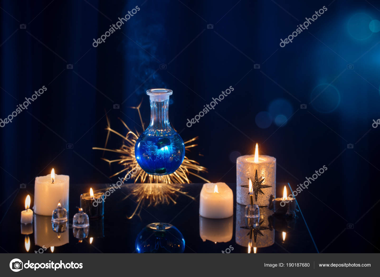 Magic potions on a blue background Stock Photo by ©Kruchenkova 190187680