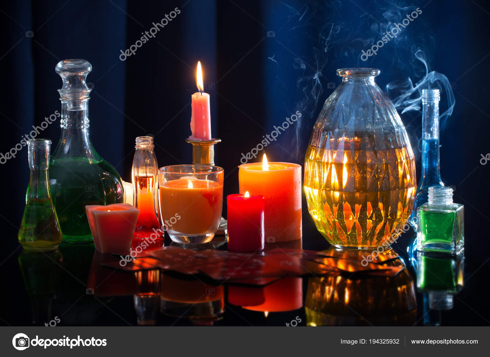 Magic potions on a blue background Stock Photo by ©Kruchenkova 194325932