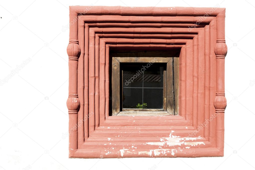 Old prison.Small red window stone ramparts, loopholes with bars ...