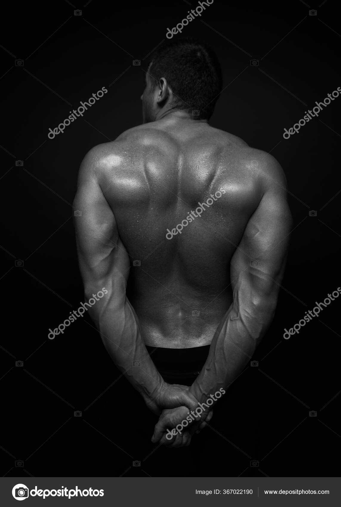 Muscled Male Model Showing His Back Stock Photo by ©vishstudio 367022190