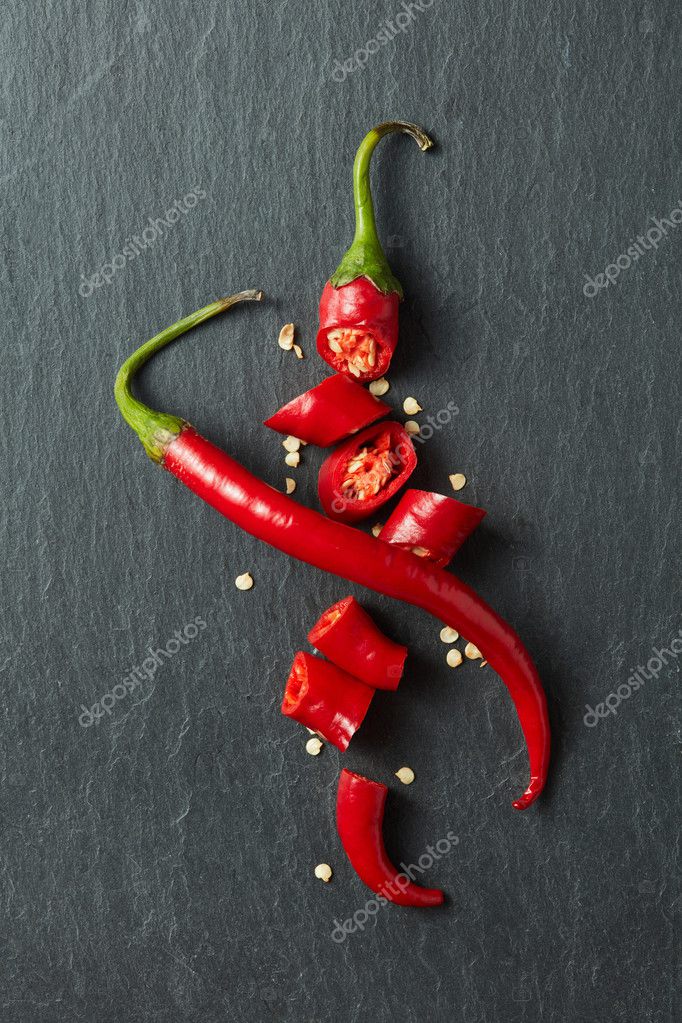Red chilli cut into slices Stock Photo by ©artjazz 127382840