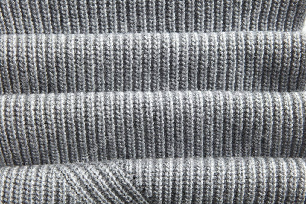 Natural warm knitted gray fabric Stock Photo by ©artjazz 129625582