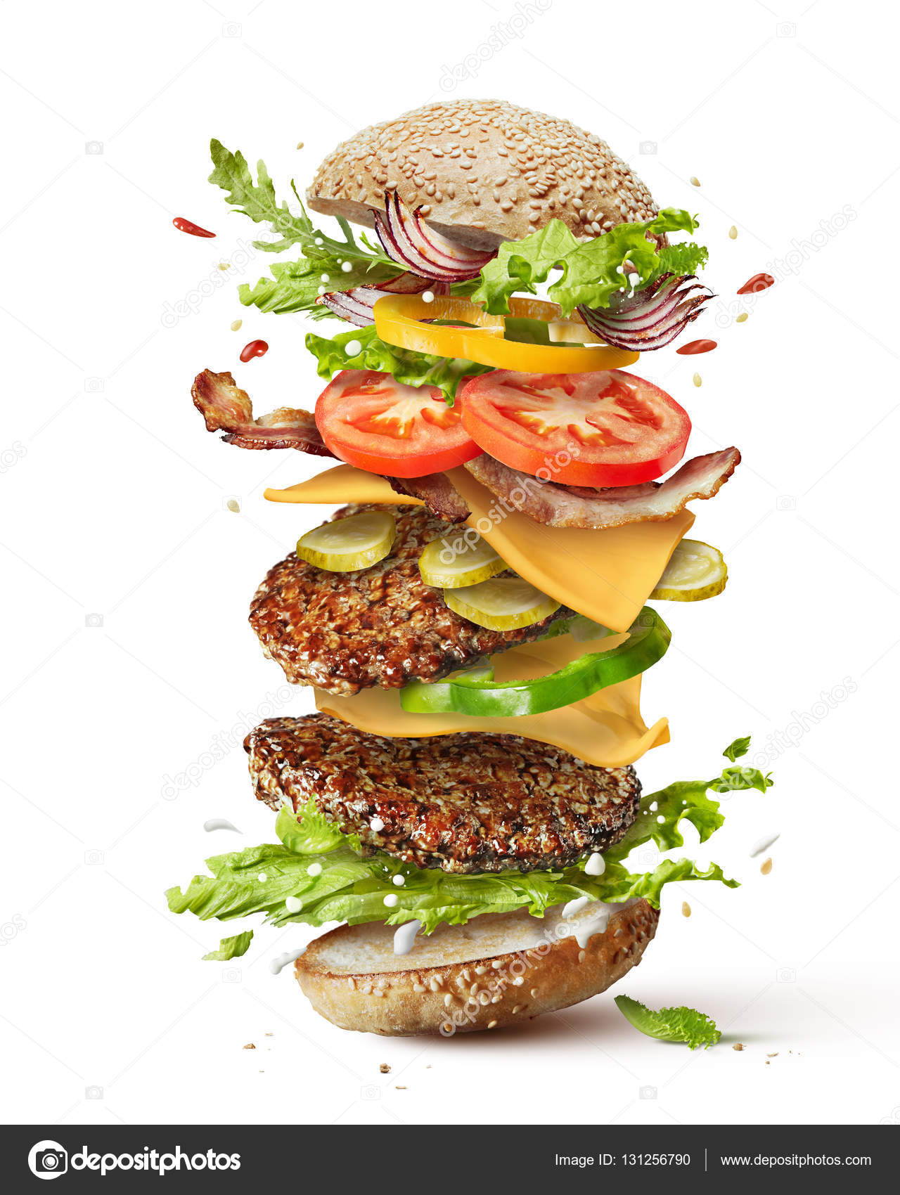 Burger with flying ingredients Stock Photo by ©artjazz 131256790
