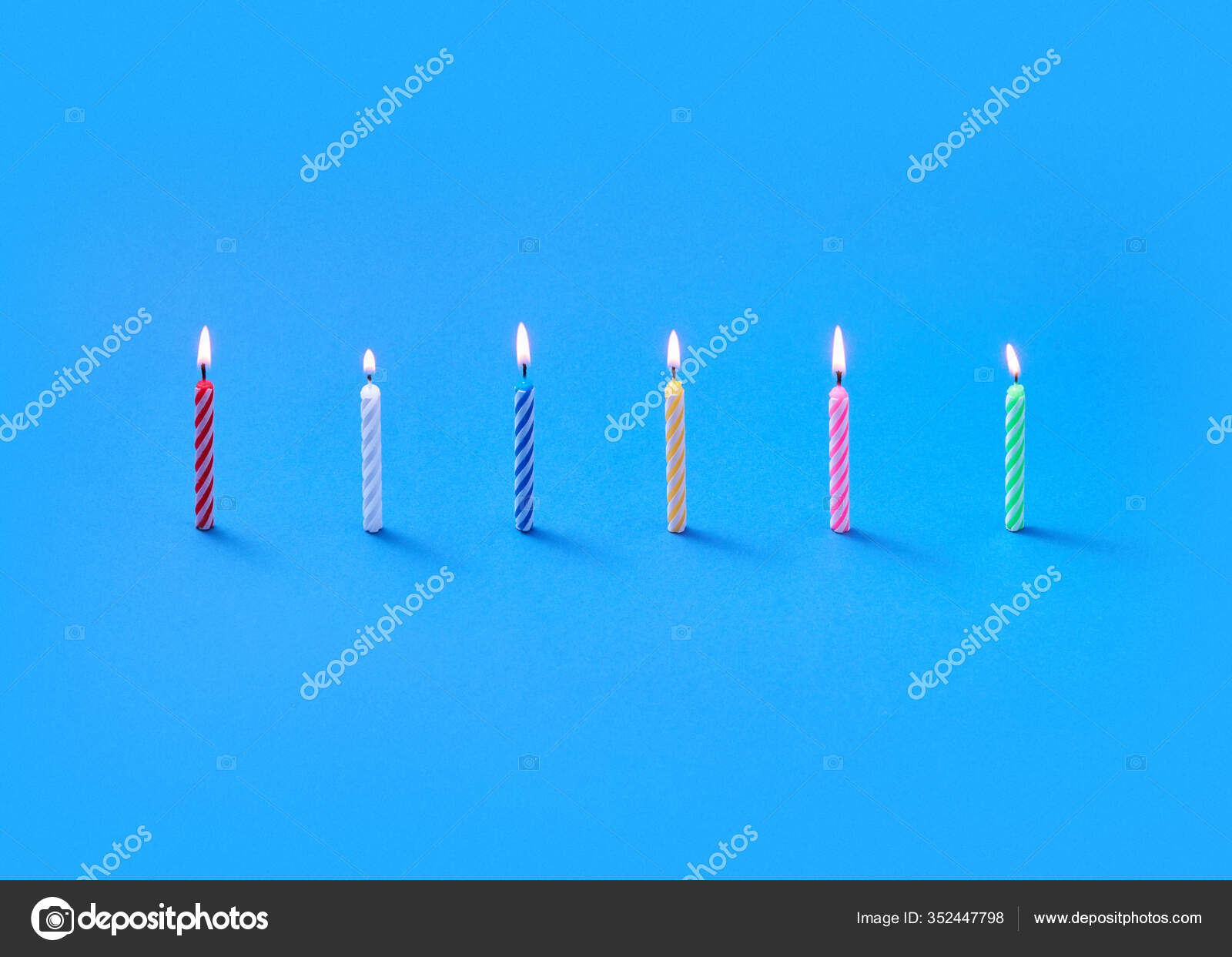 Congratulation Composition Burning Verticaly Standing Candles Sweet Cakes Blue Background