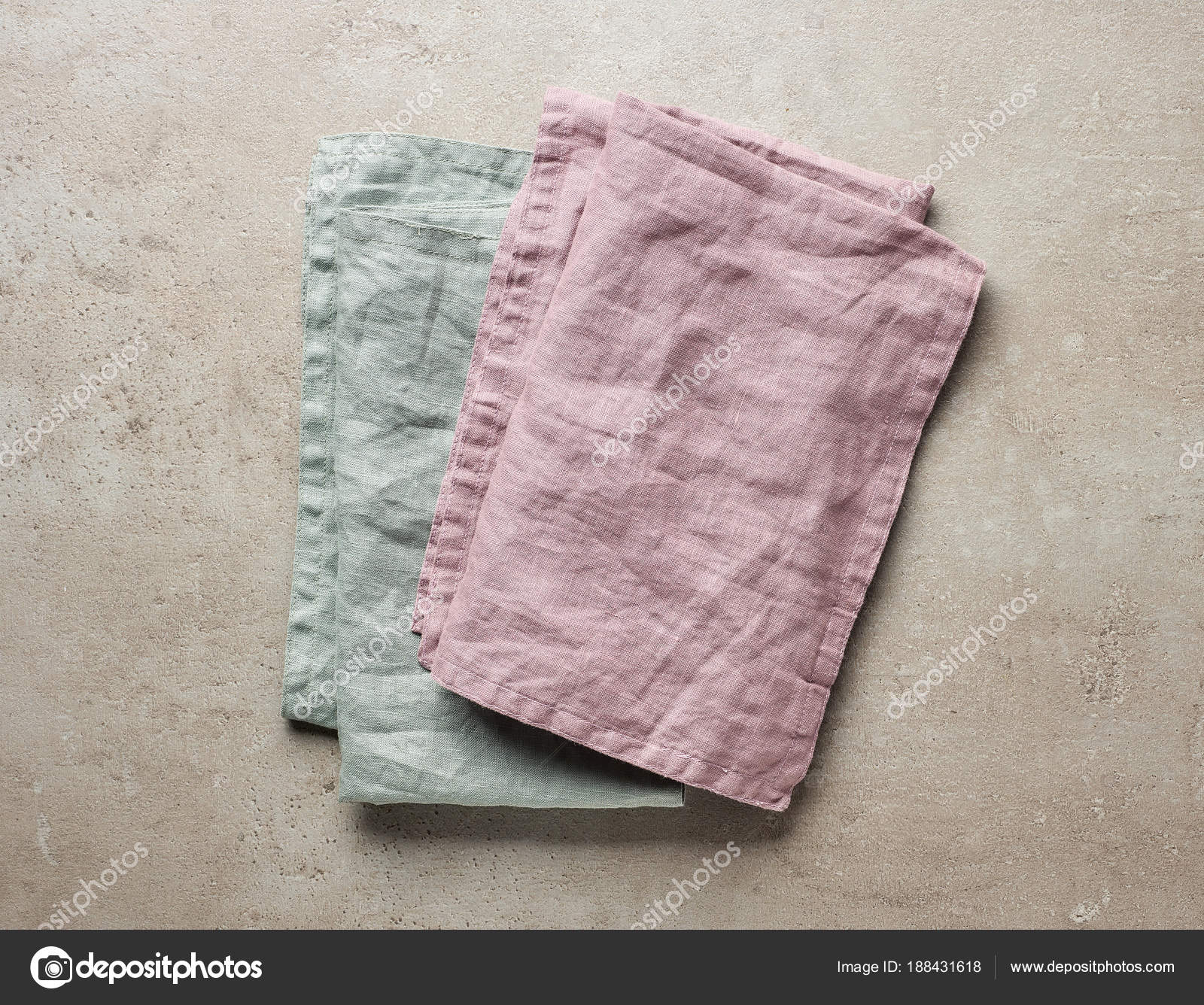 Folded linen napkin Stock Photo by ©zmaris 188431618