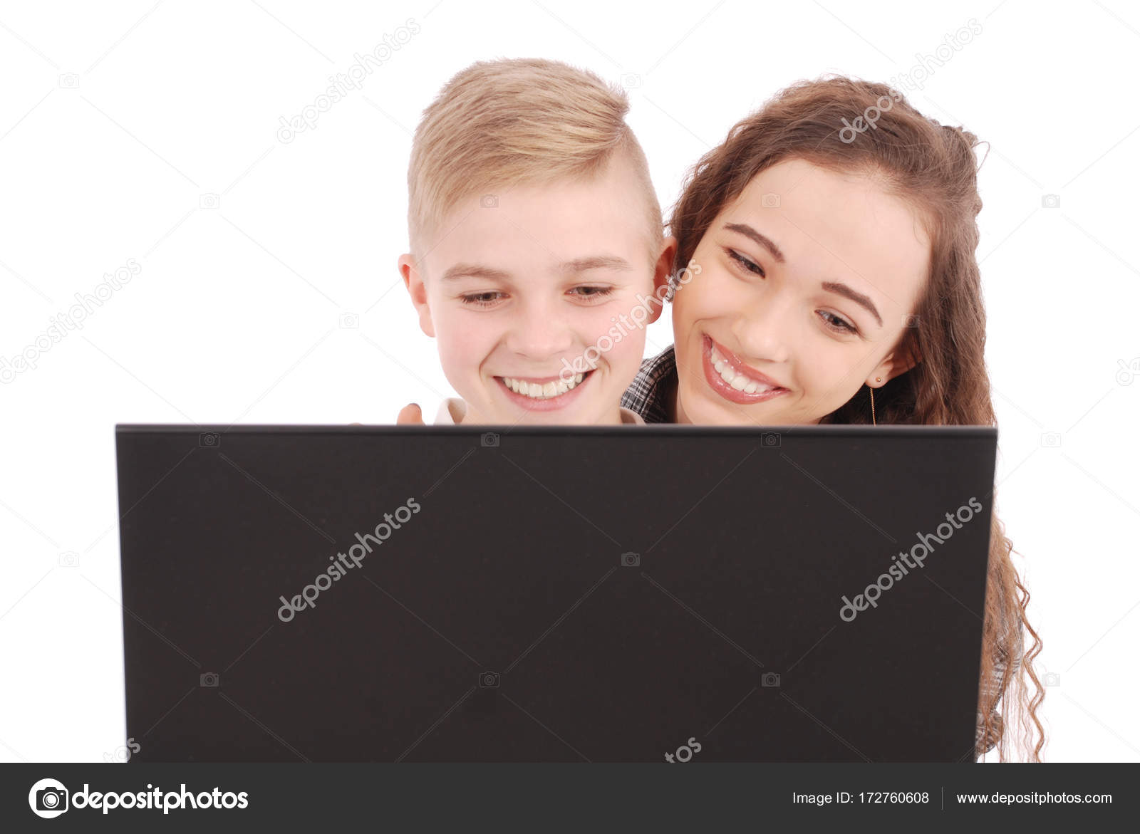 Boy and girl using a laptop isolated Stock Photo by ©akova777 172760608