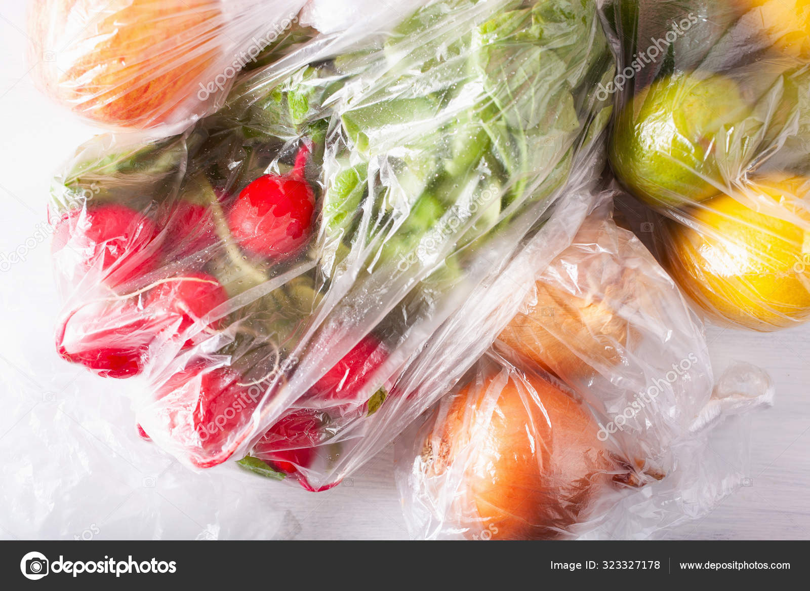 Single use plastic waste issue. fruits and vegetables in plastic Stock ...