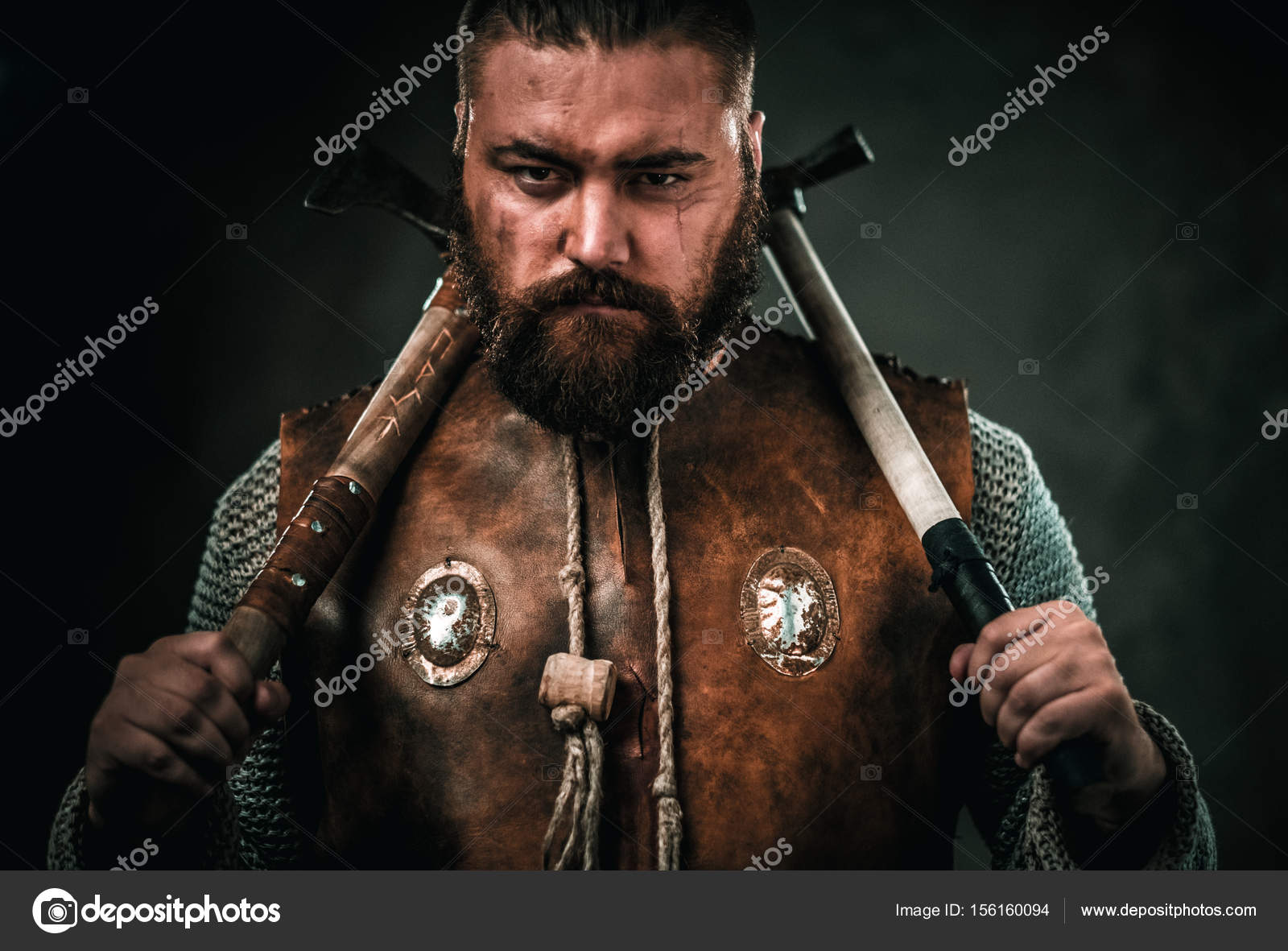 Viking with cold weapon in a traditional warrior clothes Stock Photo by ...