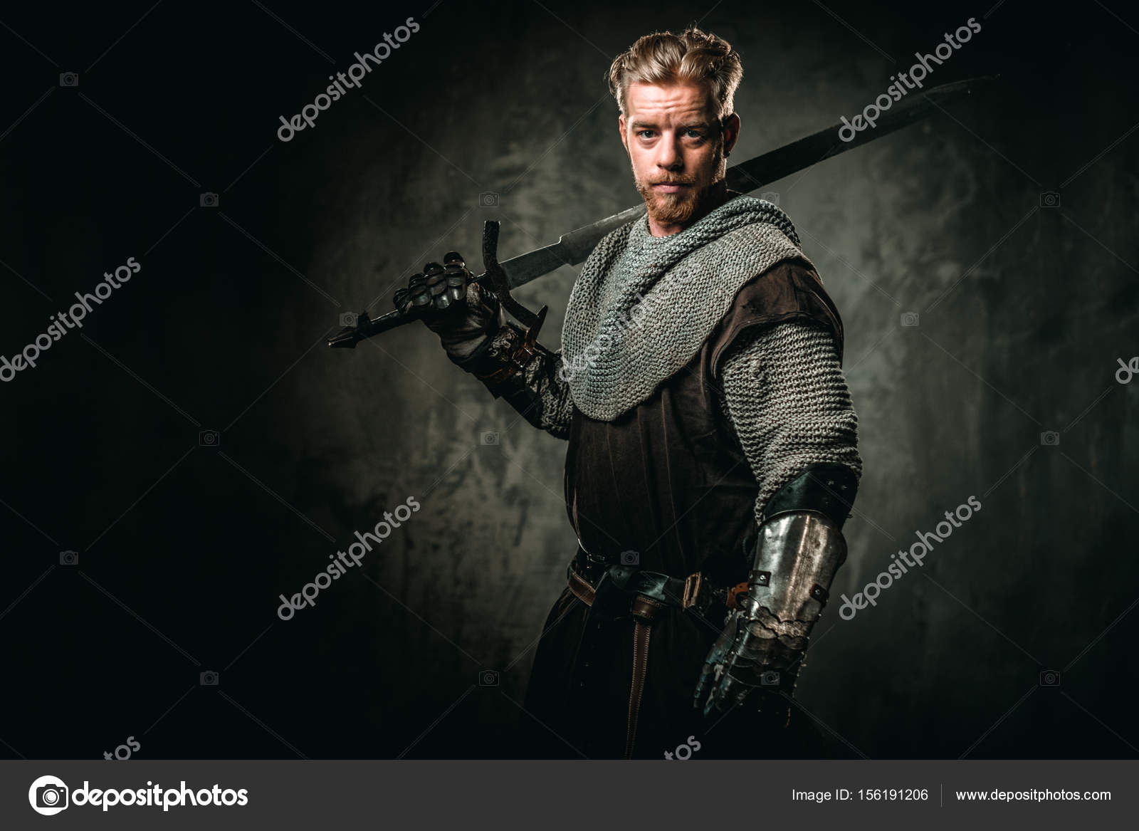 Medieval knight with sword and armour Stock Photo by ©nejron 156191206