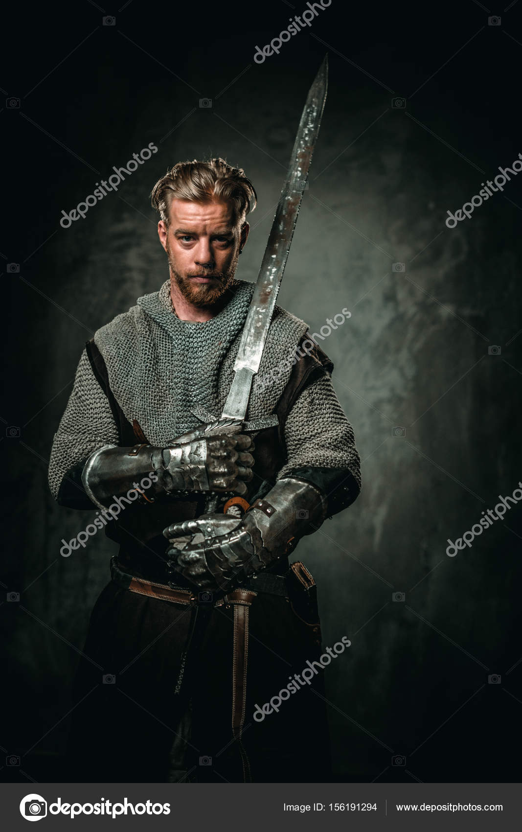 Medieval knight with sword and armour Stock Photo by ©nejron 156191294