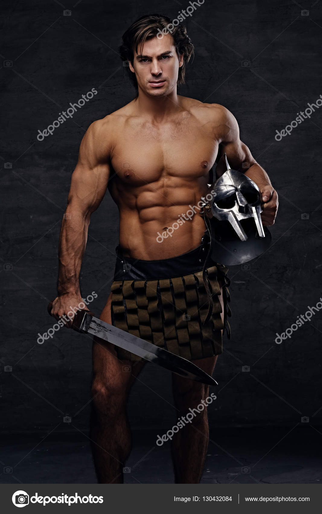 Muscular male in a Rome soldier costume Stock Photo by ©fxquadro 130432084