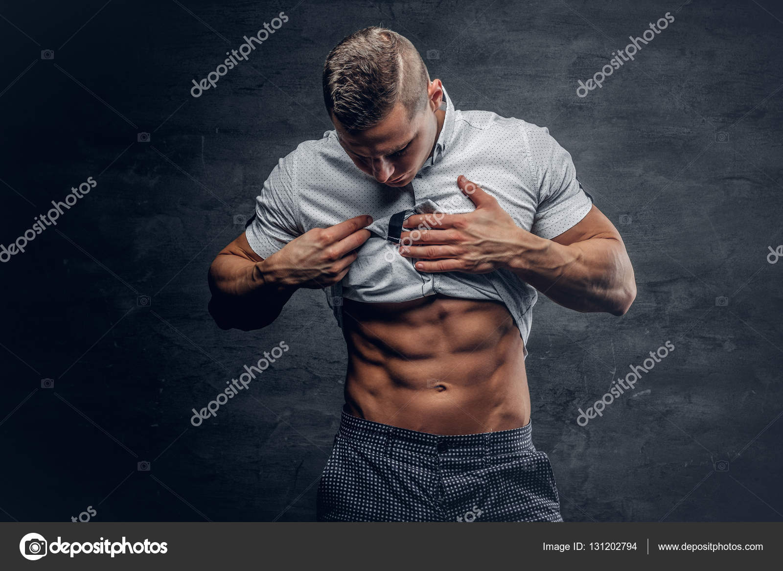 Athletic man showing six pack Stock Photo by ©fxquadro 131202794