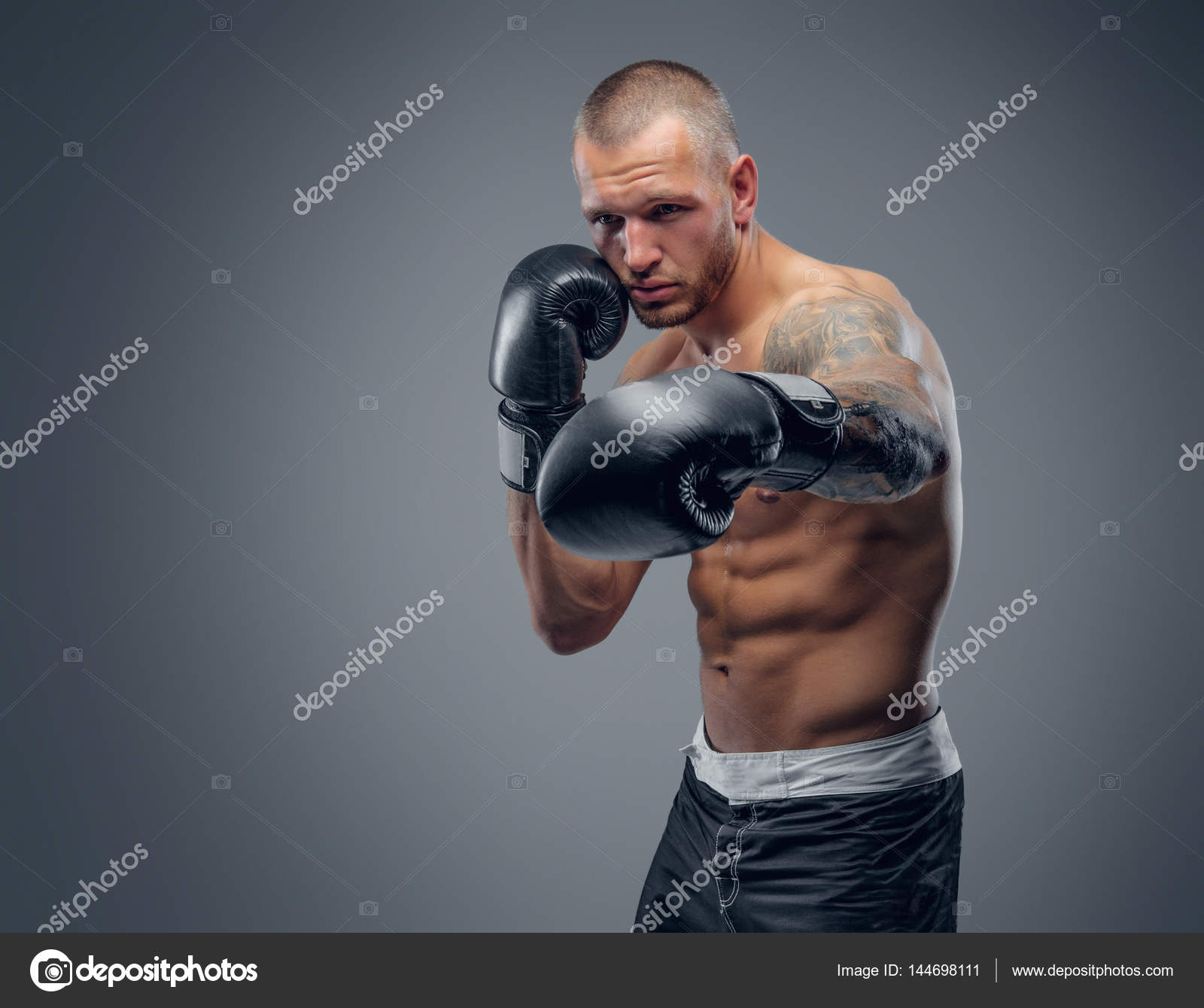 Fighter with tattoos on his body — Stock Photo © fxquadro #144698111