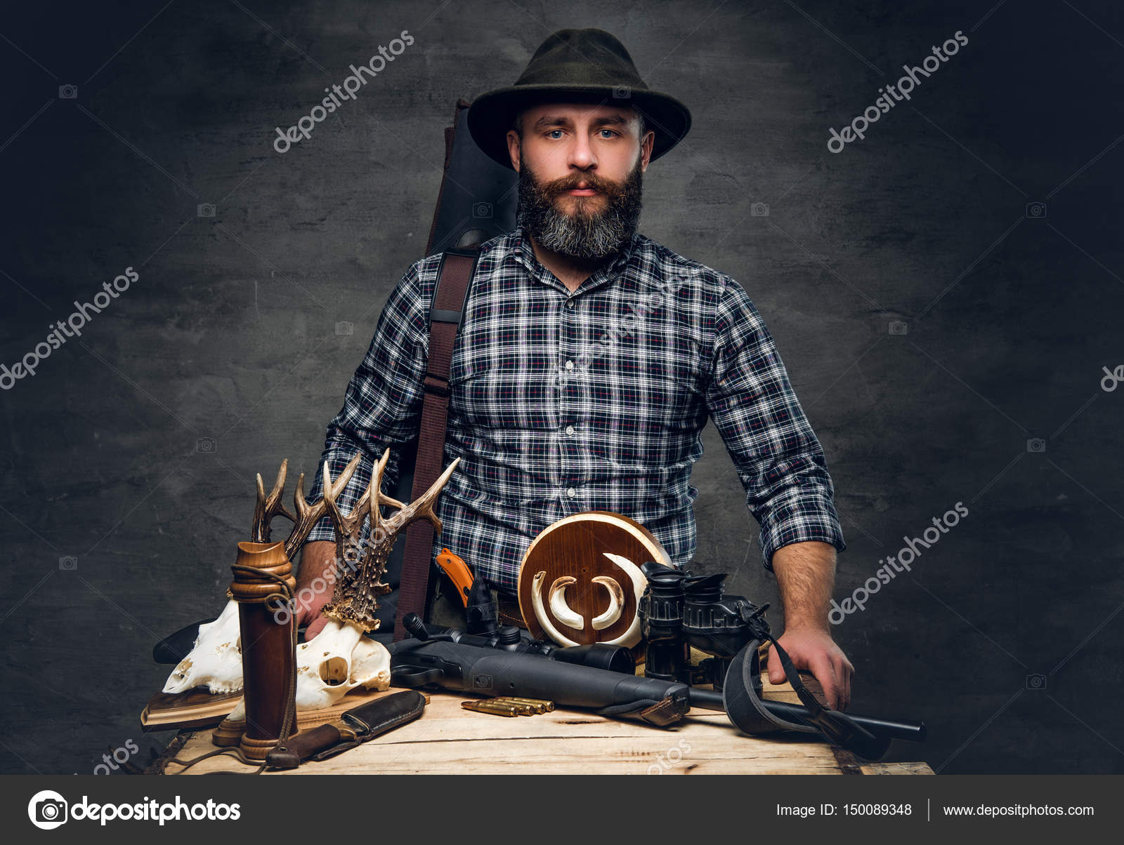 Bearded traditional hunter with rifle Stock Photo by ©fxquadro 150089348