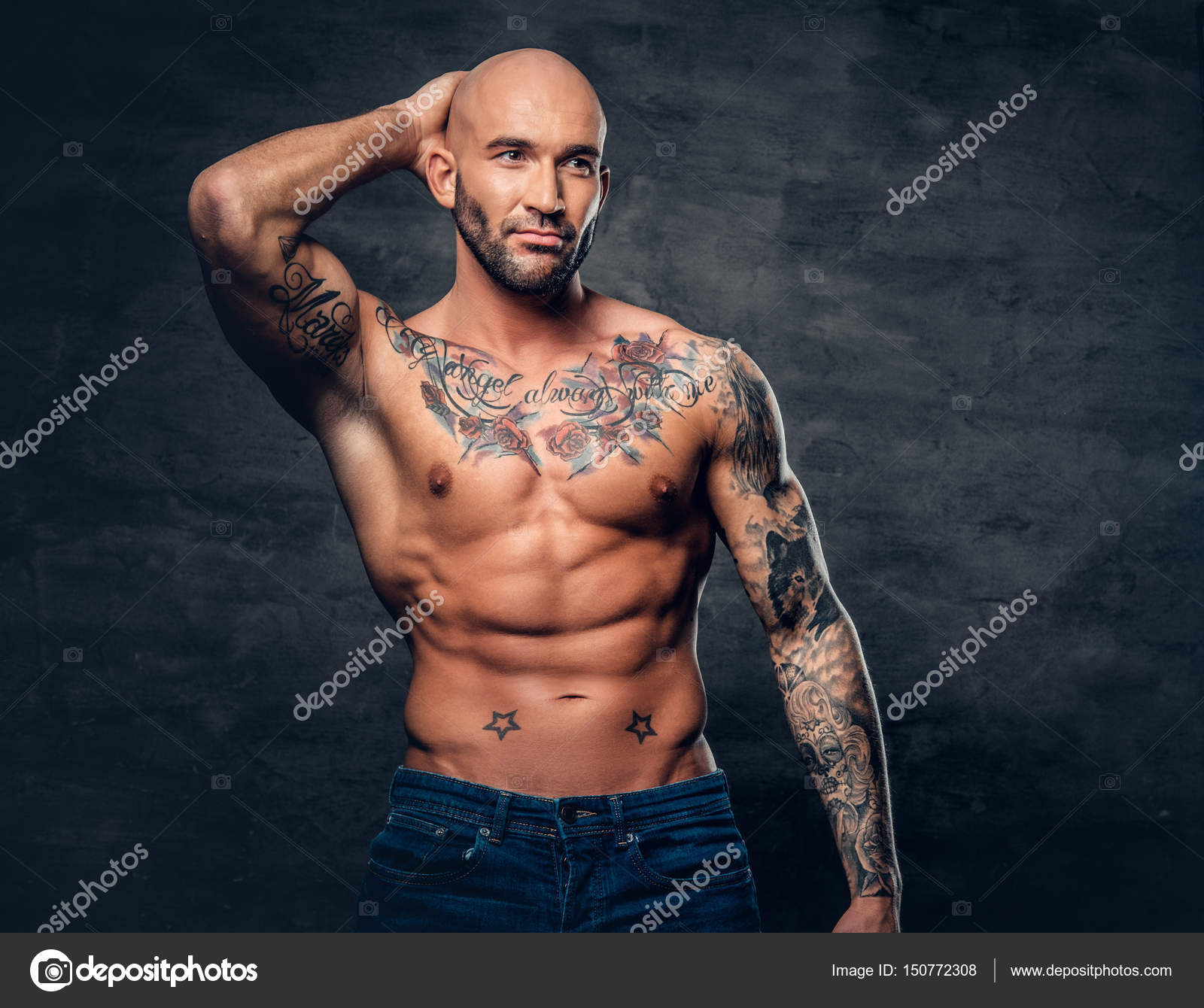 Muscular man with tattoos on torso Stock Photo by ©fxquadro 150772308