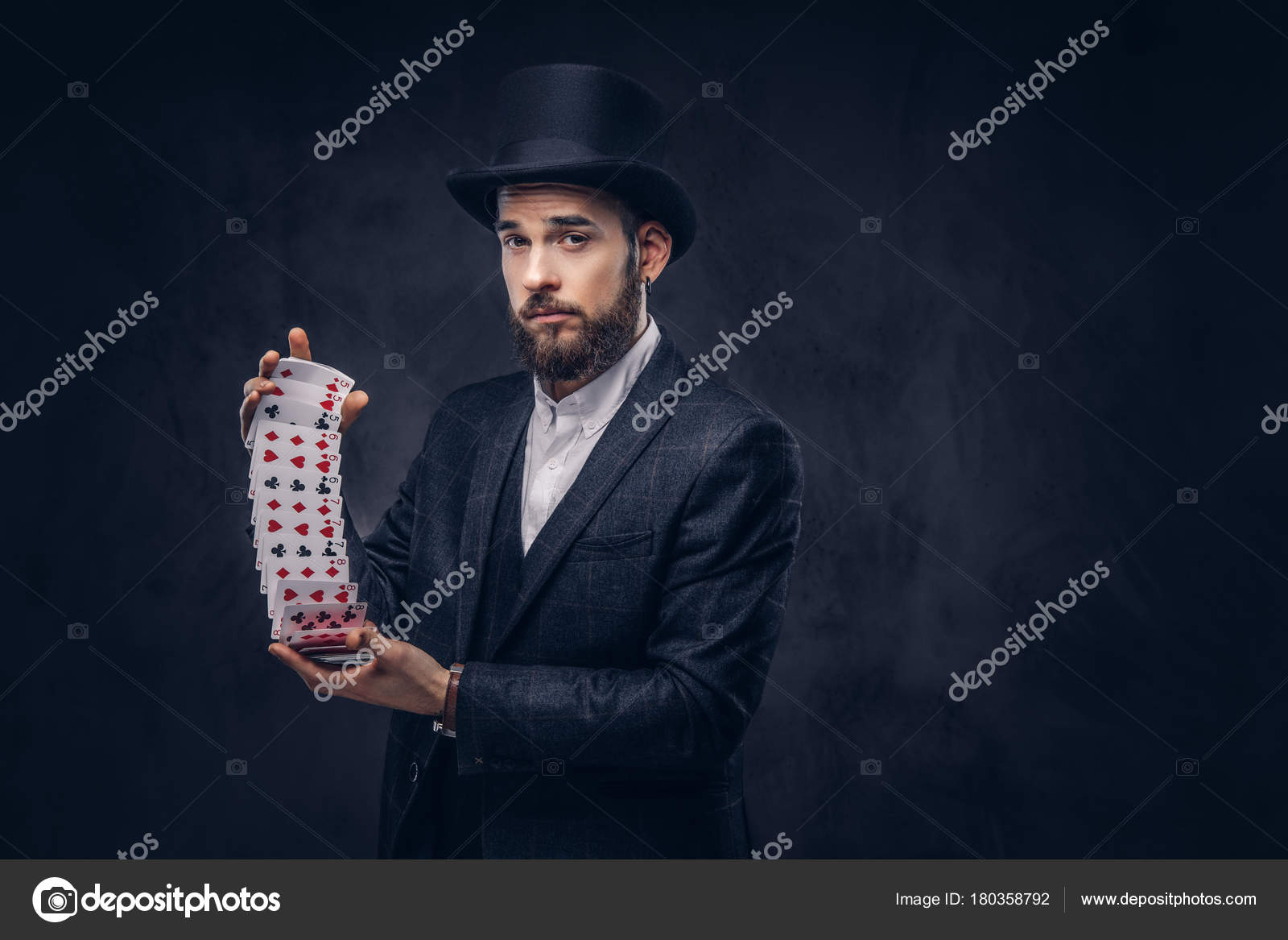 Magician showing trick with playing cards. Stock Photo by ©fxquadro ...