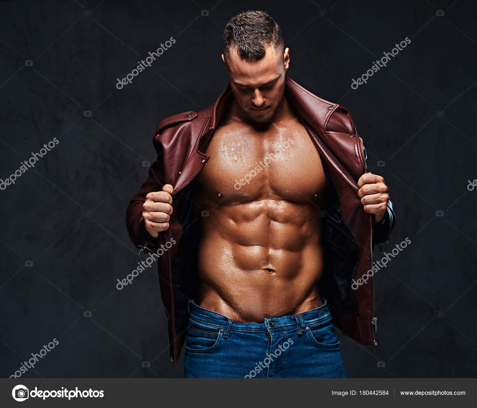 Muscular male dressed in a jacket and jeans. Stock Photo by ©fxquadro ...