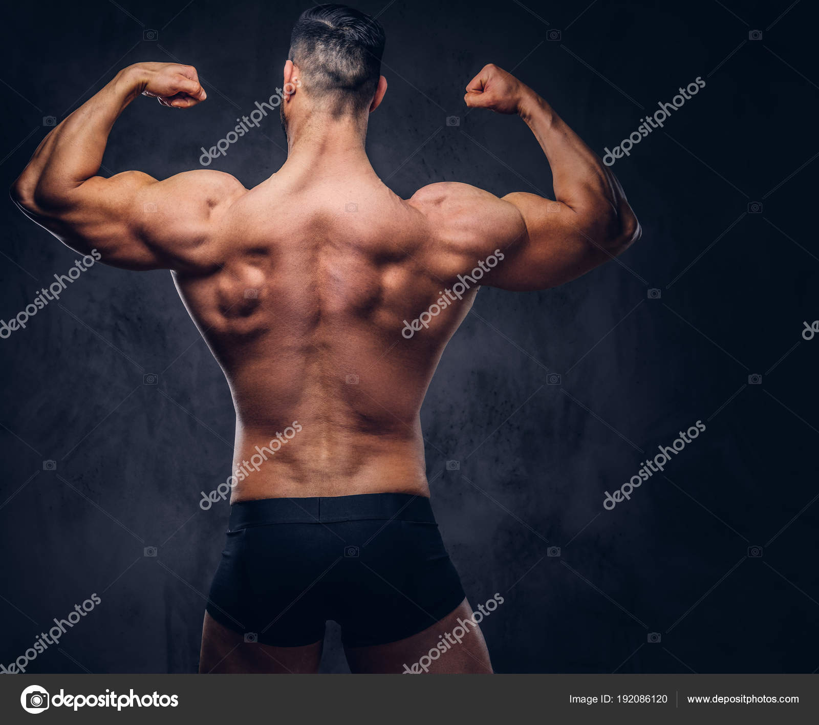 Back View Shirtless Tall Bodybuilder Shows Muscles Studio Isolated Dark ...