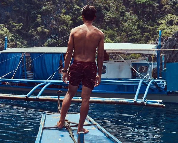 Muscular man in boat — Stock Photo © dontcut #2890644