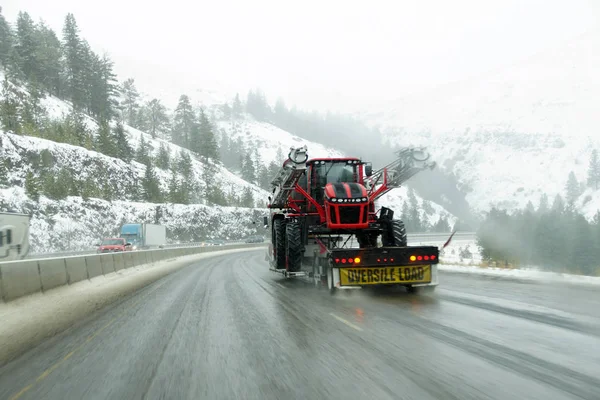 Winter service truck for snow plow clearing road after winter snowstorm ...