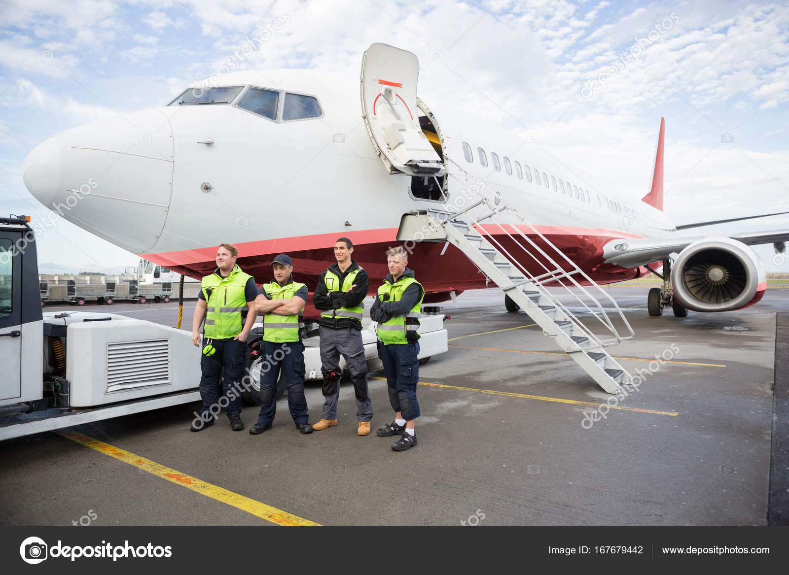 Confident Ground Team Standing Arms Crossed Against Airplane — Stock ...