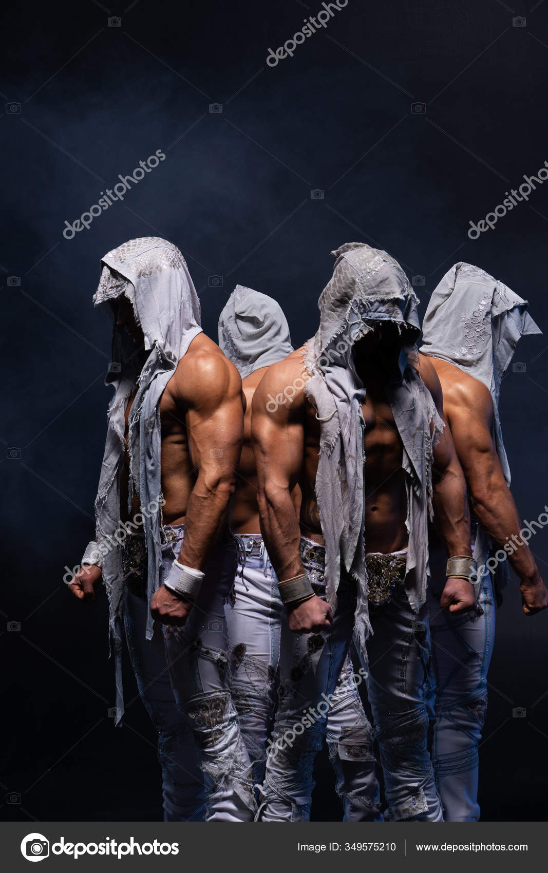 Four muscular gothic man standing shirtless on black background ...