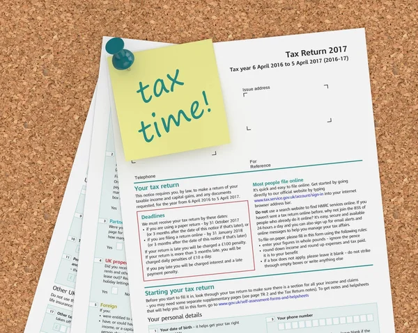 SA100 tax form with note anuual tax return text pinned to cork — Stock ...