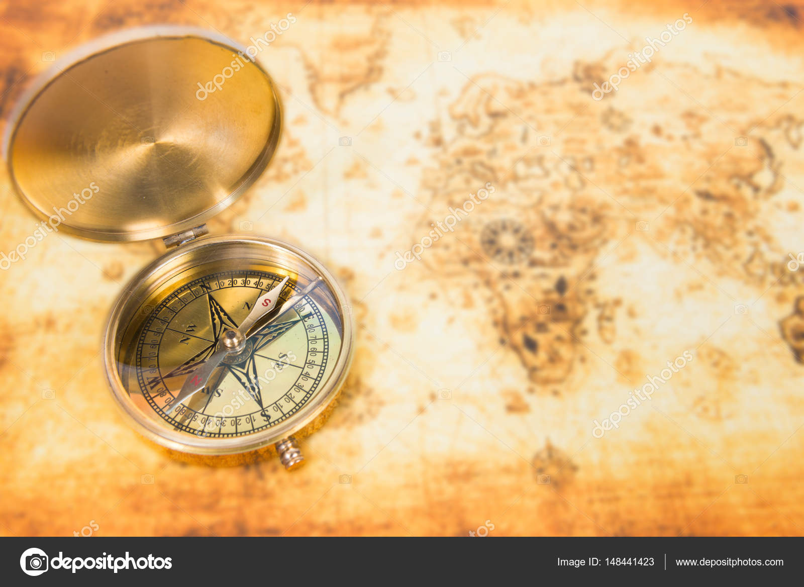 Old map with an ancient compass Stock Photo by ©dovapi 148441423