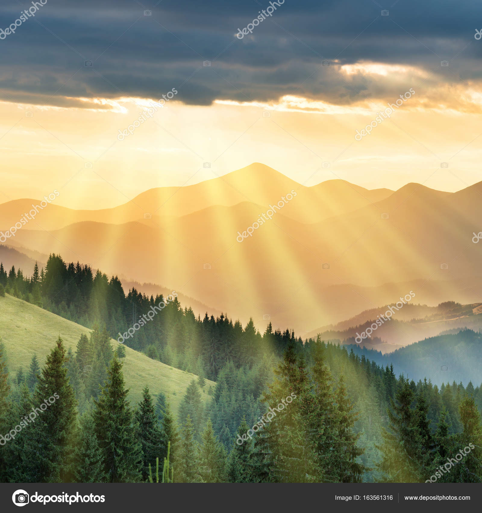 Sun rays over mountains range Stock Photo by ©dovapi 163561316