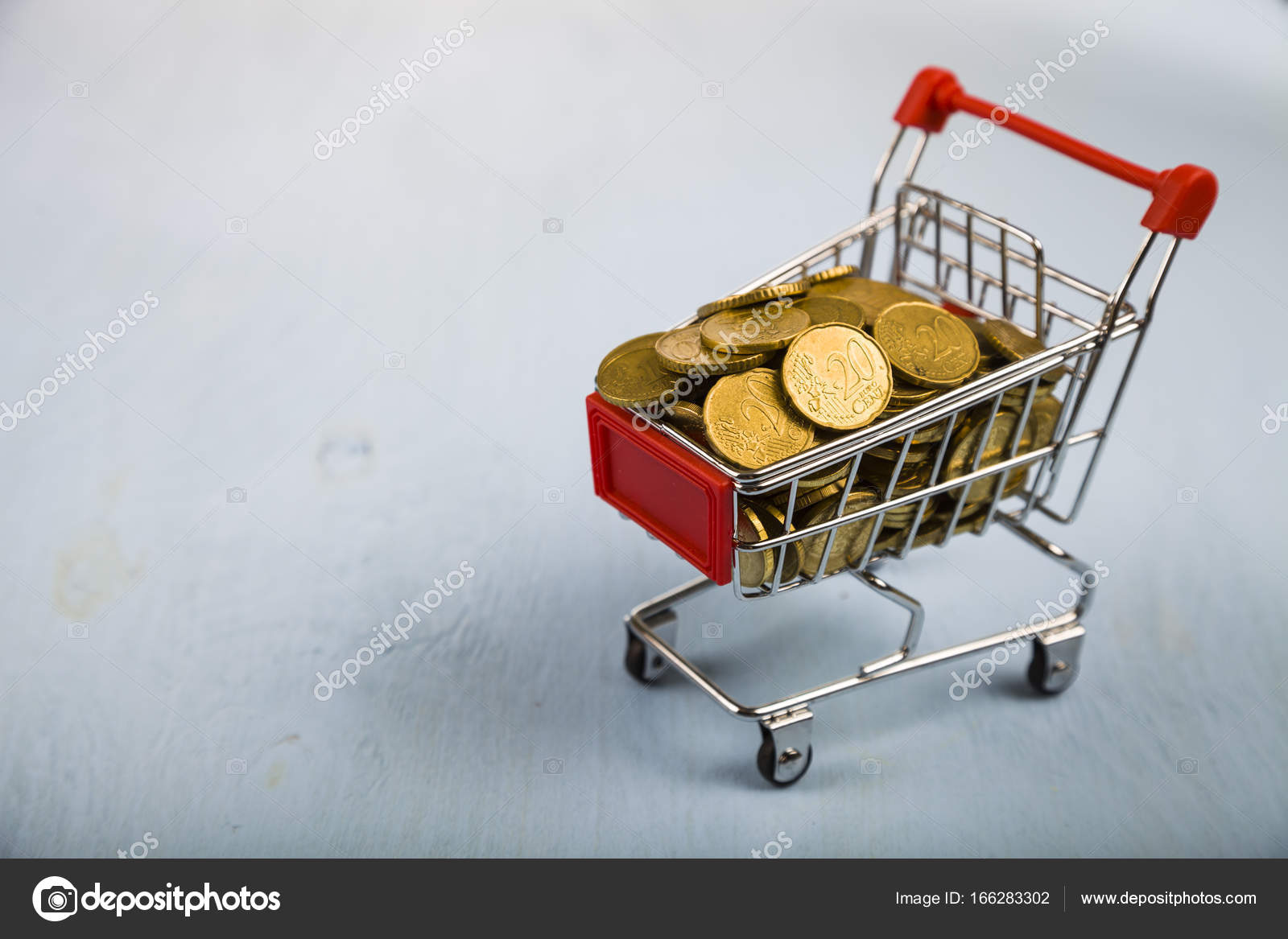 Shopping trolley with coins Stock Photo by ©Enika100 166283302