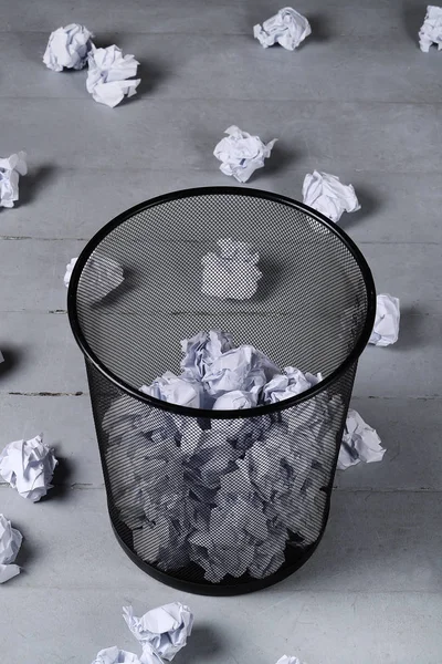 Creased paper in a trash can - Stock Image - Everypixel