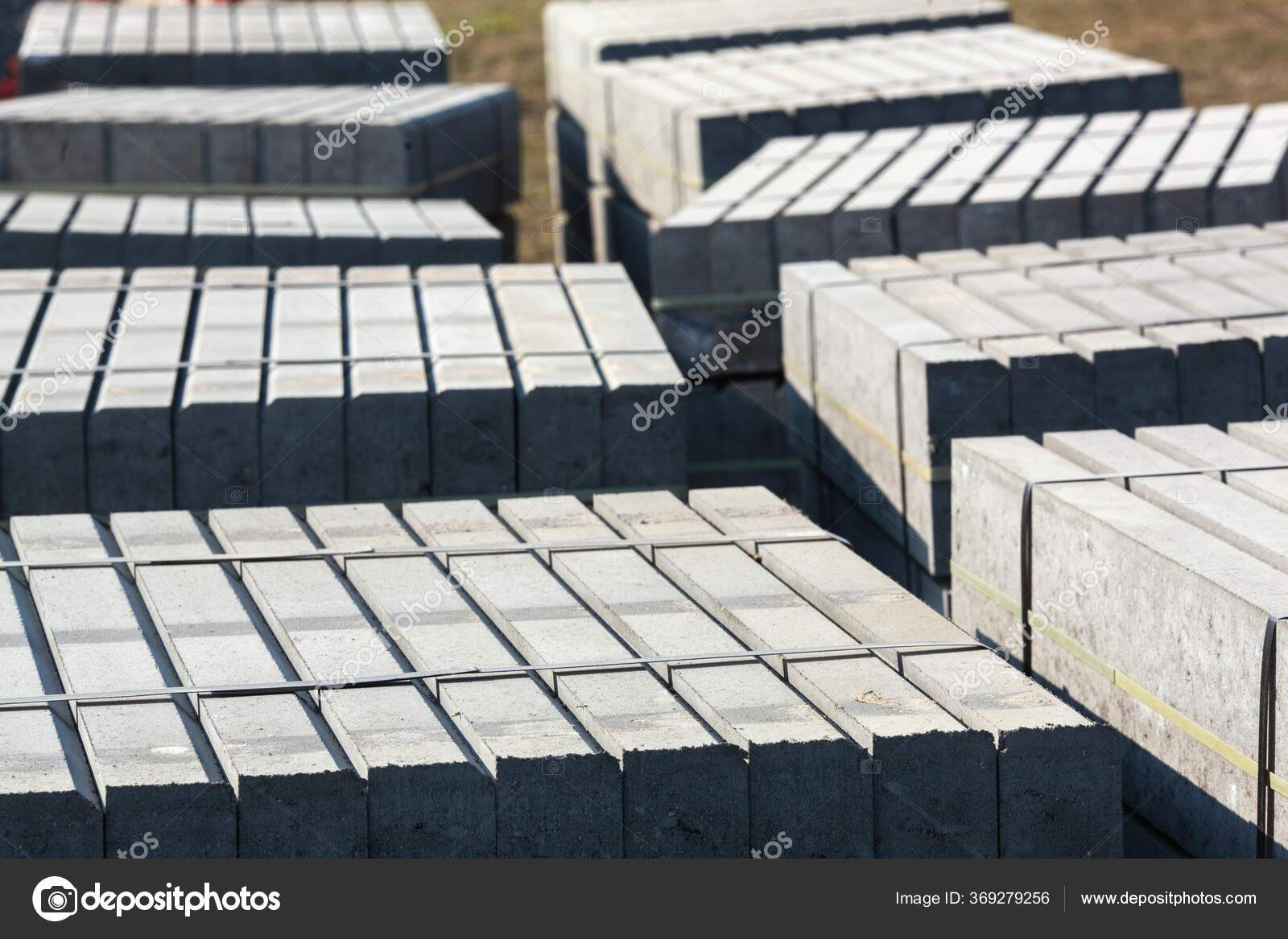Piled concrete curbstones. Construction material for road construction ...