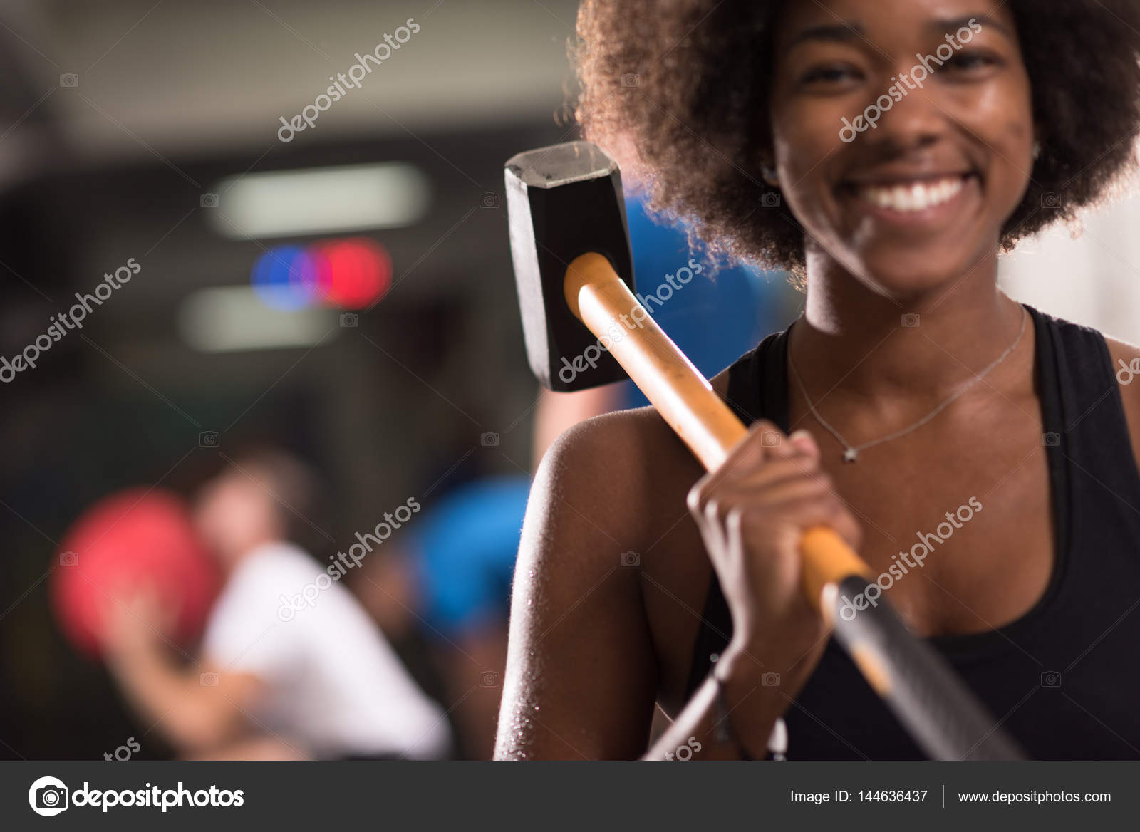 Black woman after workout with hammer — Stock Photo © .shock #144636437