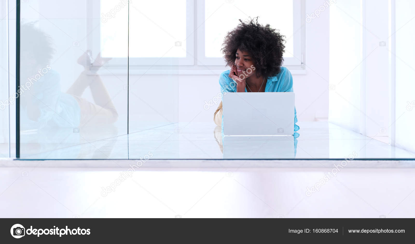 Black woman using laptop computer on the floor — Stock Photo © .shock ...