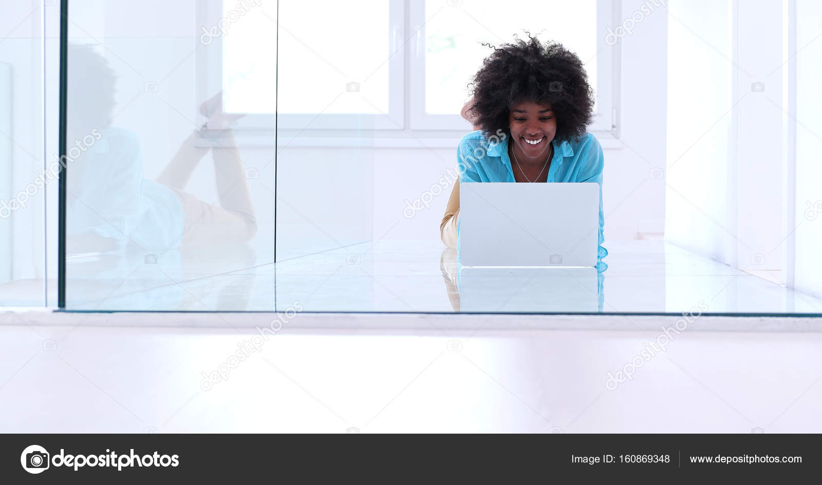 Black woman using laptop computer on the floor — Stock Photo © .shock ...