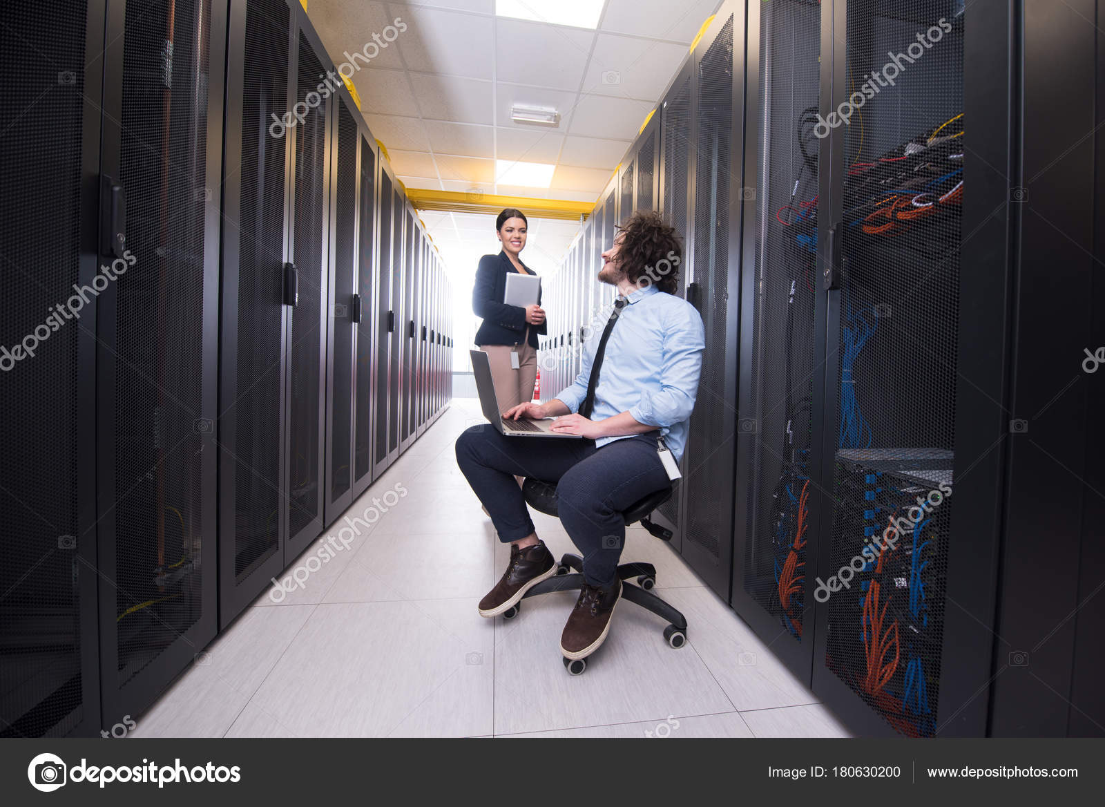 Team of young technicians working together on servers — Stock Photo ...