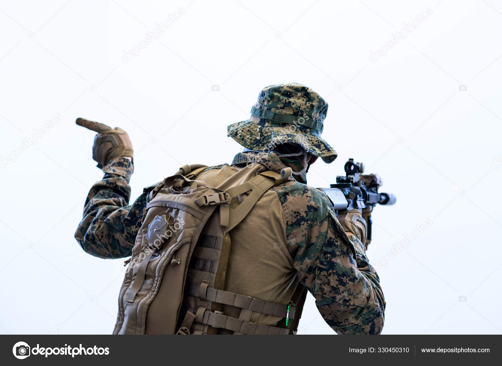 Soldier in action giving comands to team by hand sign — Stock Photo ...