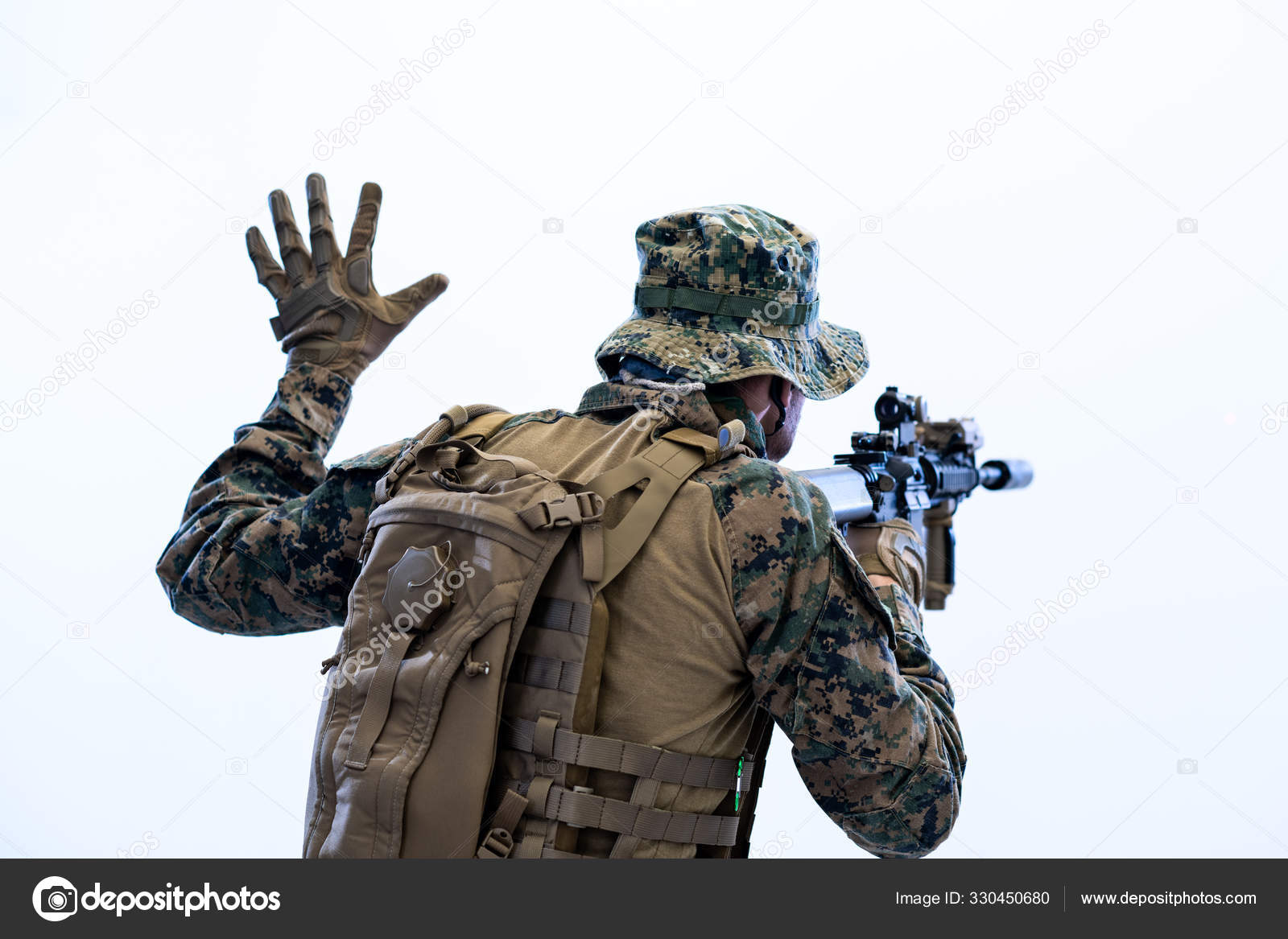 Soldier in action giving comands to team by hand sign Stock Photo by ...