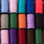 Textile machine with rainbow colors threads — Stock Photo © tdhster ...