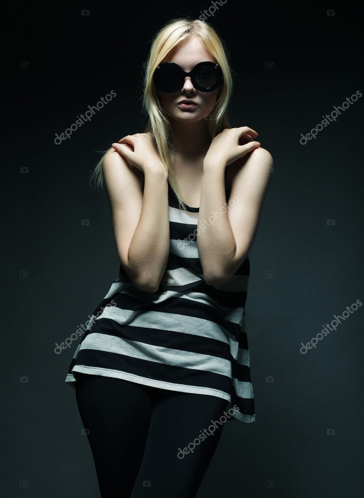 Pretty fashion model on grey background Stock Photo by ©kanareva 128383070