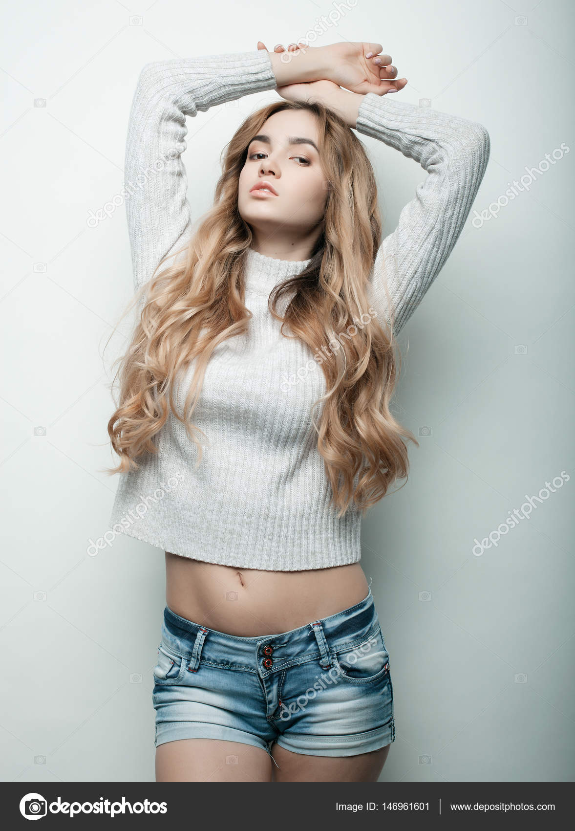 Fashion model posing in studio, white background Stock Photo by ...