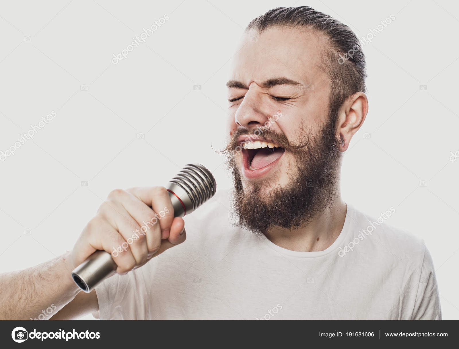 Boy Rocking Out. Image of a handsome bearded man singing to the ...