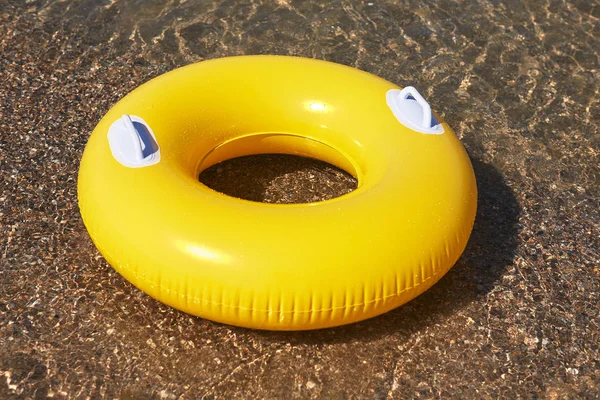 Yellow swim ring floating on a sea Stock Photo by ©Sergios 192027998