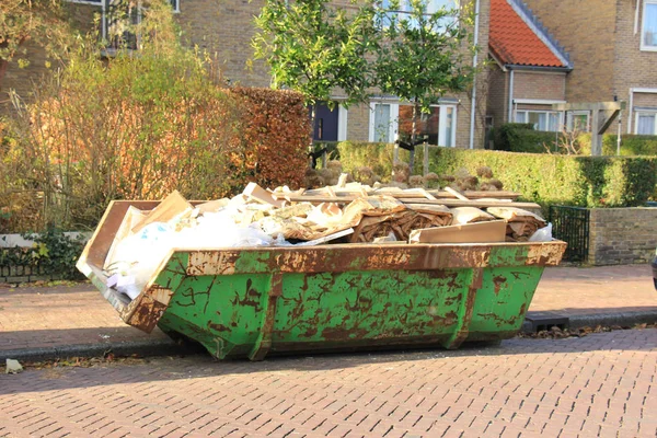 Loaded garbage dumpster ⬇ Stock Photo, Image by © portosabbia #183933916